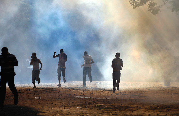 Protesters angry over slow prosecution of old regime clash with police ...