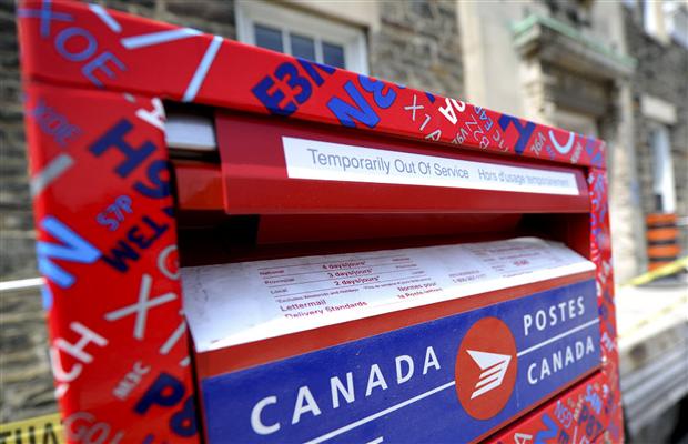 Canada Post employees begin sorting through mail backlog | Globalnews.ca