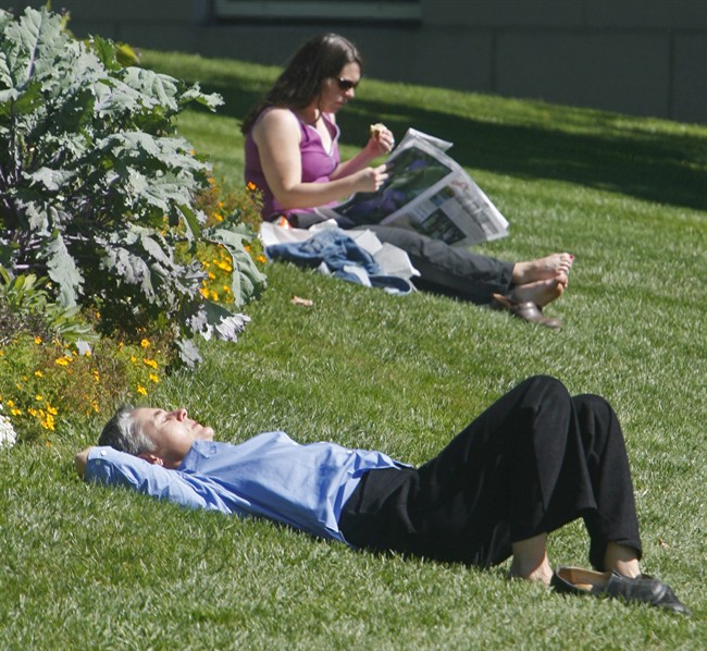 Heat oppressive but sunny days lift spirits of people with seasonal ...