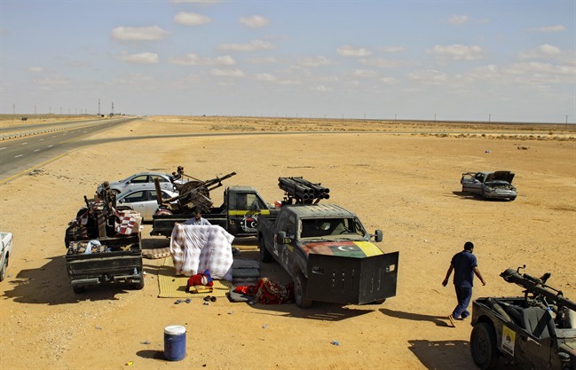 A Gadhafi son vows no surrender to Libyan rebels, while another urges ...