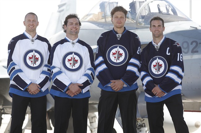 Winnipeg’s new NHL team will be jetting around the ice in navy blue ...