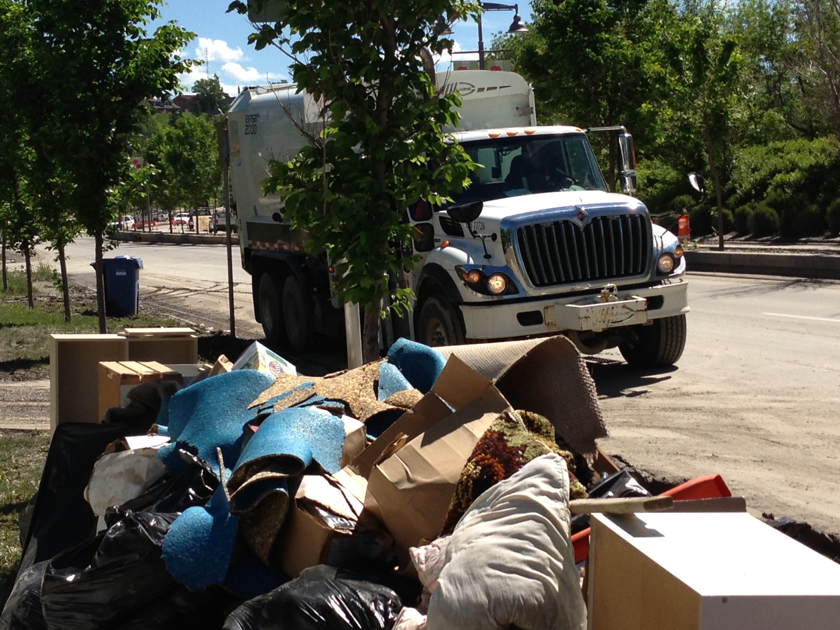 City works to dispose of garbage left behind from floods - Calgary ...