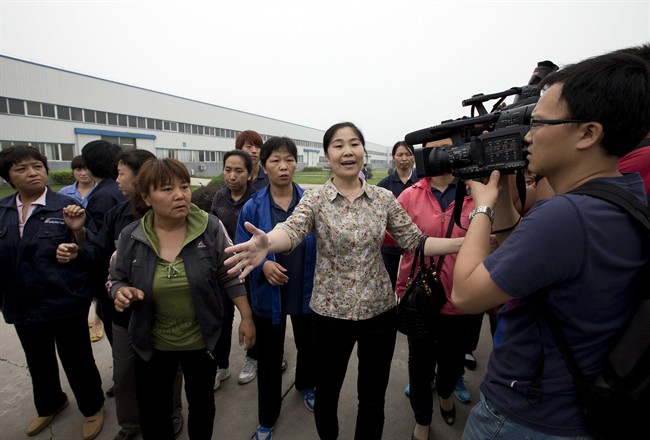 Chinese workers hold US boss, say wages unpaid - National | Globalnews.ca