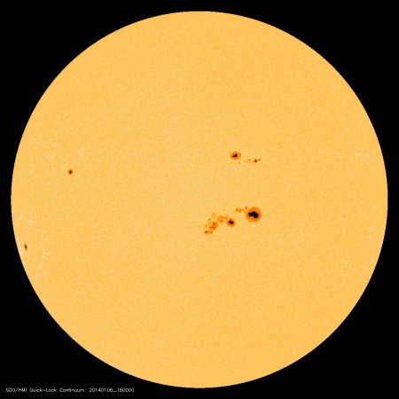 Giant sunspot erupts with large solar flare, chance of northern lights ...