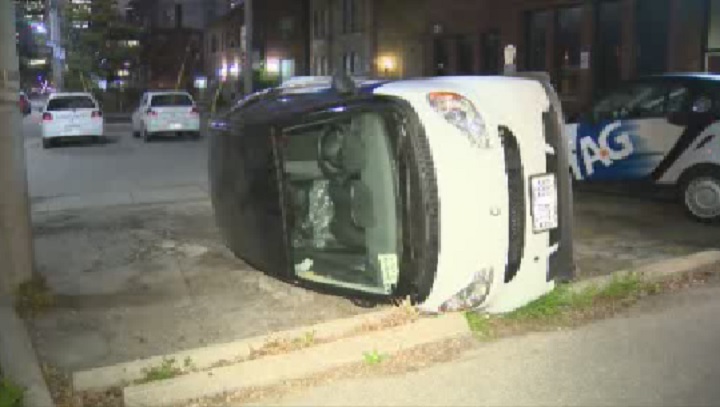 WATCH: Vandals tip over car in downtown Toronto - Toronto | Globalnews.ca