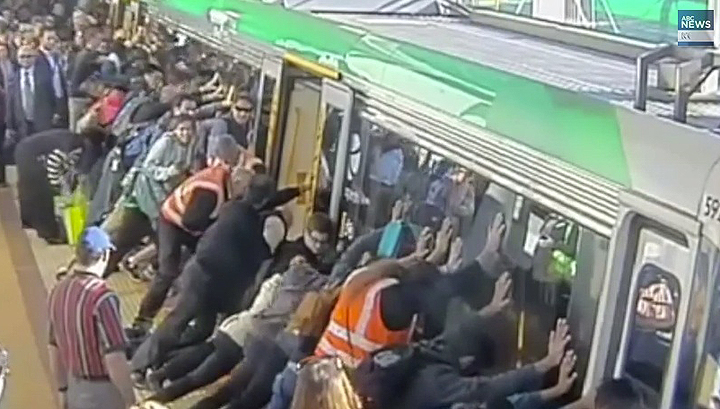 WATCH: Commuters in Australia push train carriage to free trapped man ...