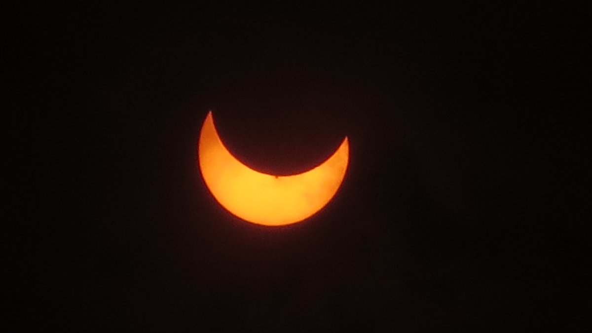 In Photos: Partial solar eclipse and giant sunspot wows observers ...