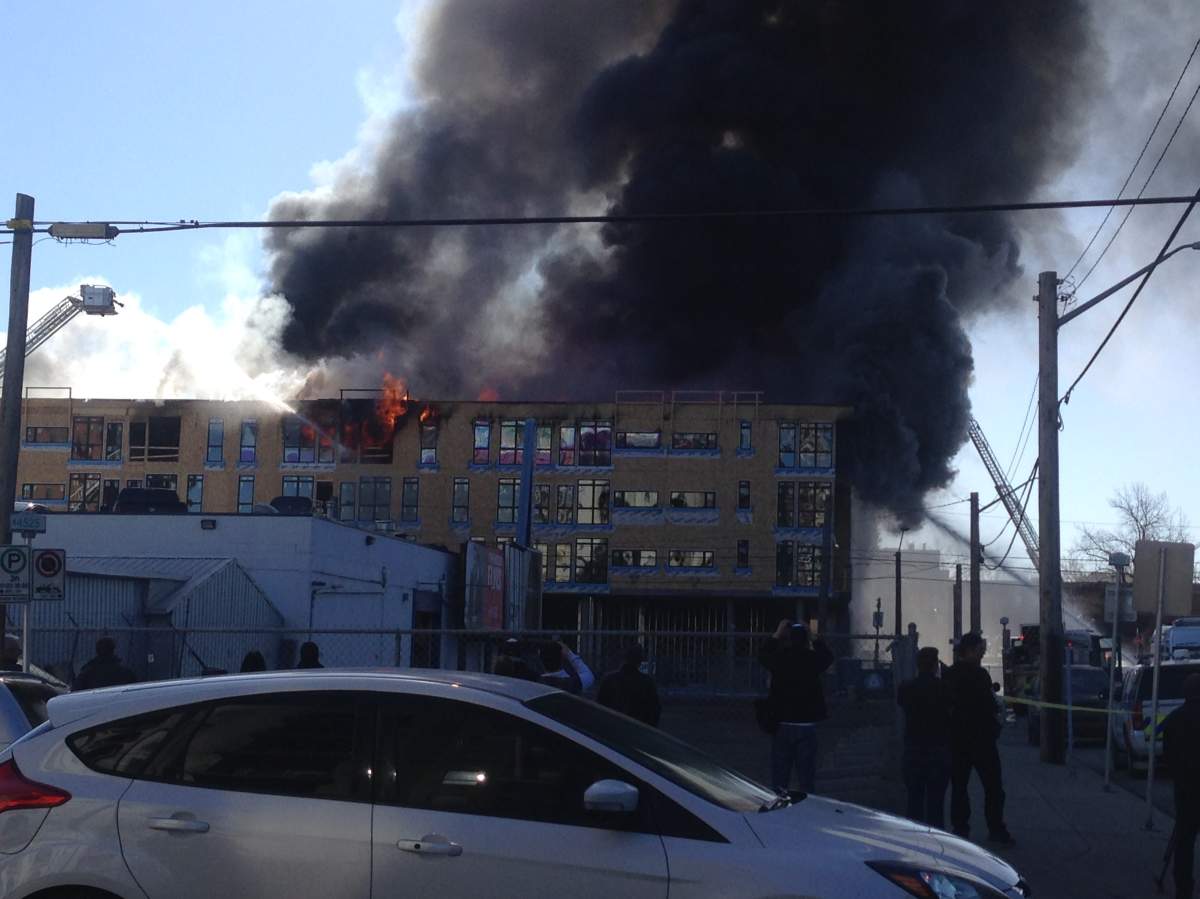 WATCH: Fire crews battle massive fire south of downtown | Globalnews.ca