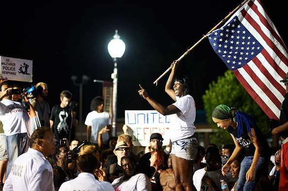 Demonstrators mark the 1-year anniversary of Michael Brown’s death in ...
