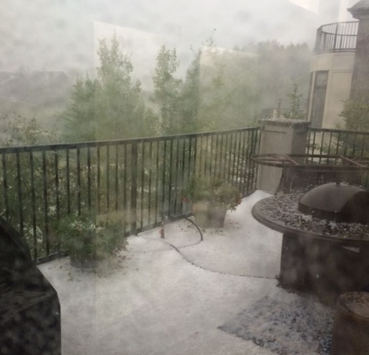 Flash flooding closes roadways as Calgary pummeled by hail storm ...