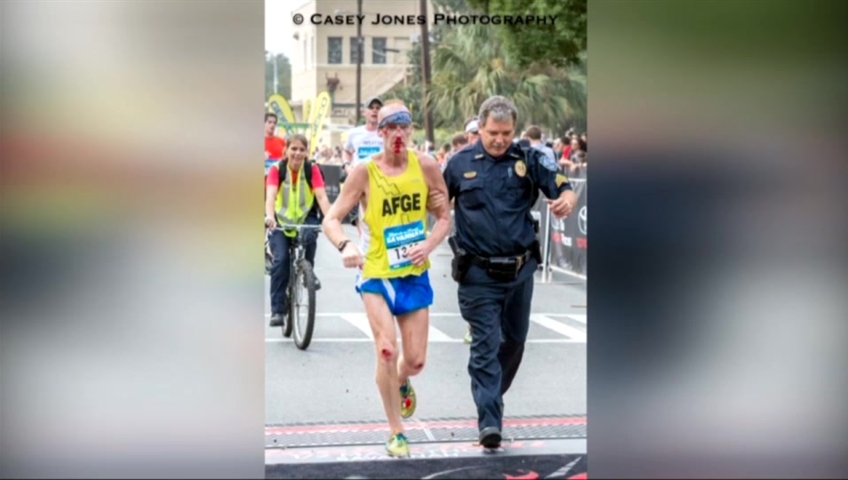 Georgia cop helps carry fallen marathon runner across the finish line ...