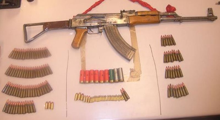 Four people face 60 charges after assault rifle seized in Toronto raid ...