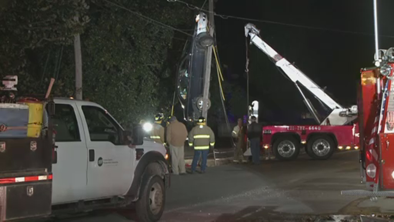 WATCH: Driver rescued from car stuck in power lines after ‘freak ...