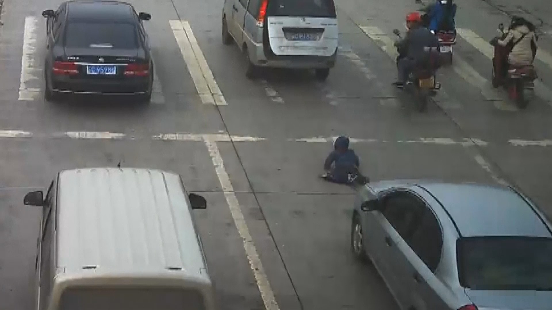 Caught on camera: Boy survives being run over after falling out of van ...