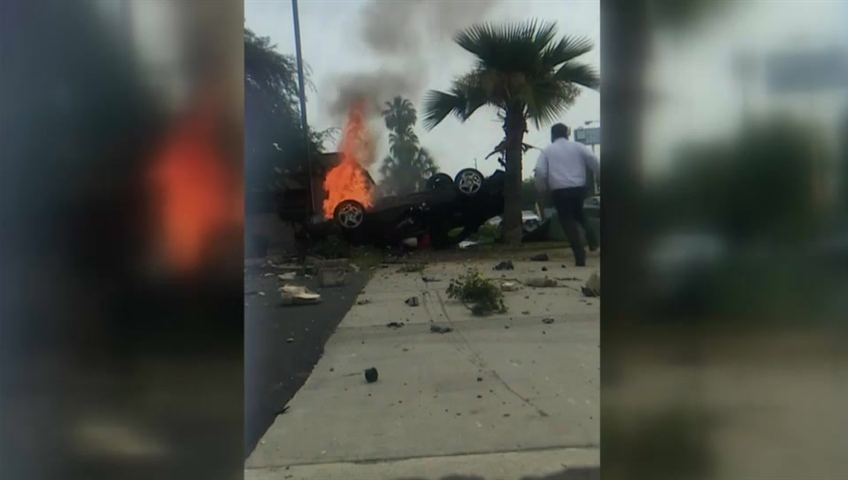 Caught on camera: Man pulls driver from burning car moments after crash ...
