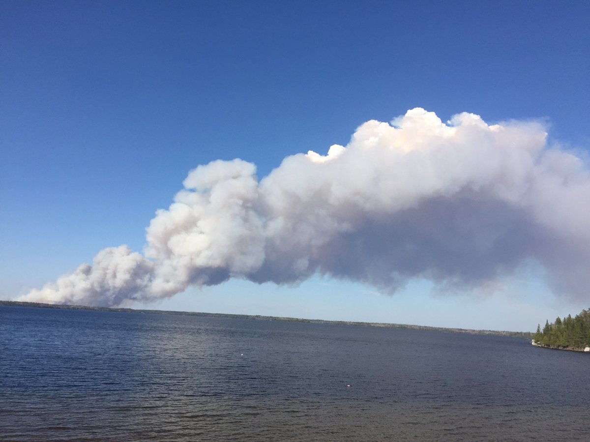 Forest fires spreading along Manitoba, Ontario border, mandatory ...