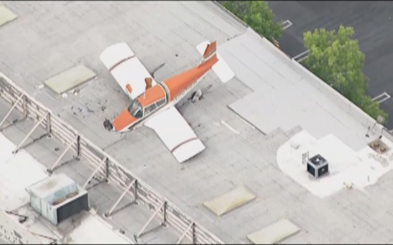 Small plane crashes onto roof of California building - National ...