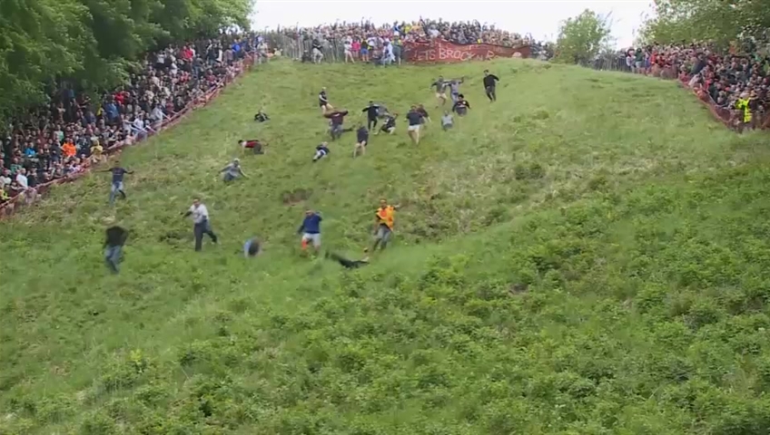 Hundreds chase runaway cheese wheel down steep hill in the UK ...
