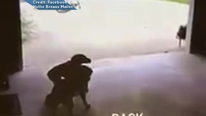 Little boy sneaking into neighbour’s garage to hug dog caught on camera ...