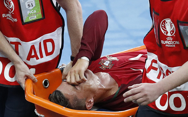 Cristiano Ronaldo carried off of pitch with knee injury in Euro Cup ...