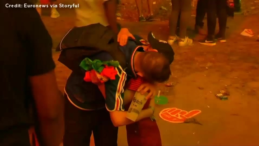 Caught on camera: Portuguese boy hugs crying French soccer fan after ...