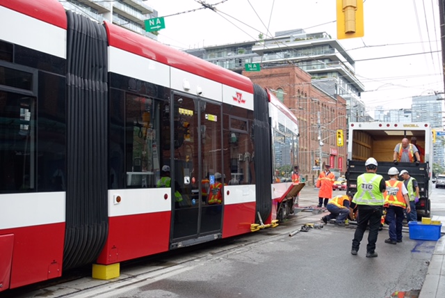 New streetcar derails in downtown Toronto after pushing older streetcar ...