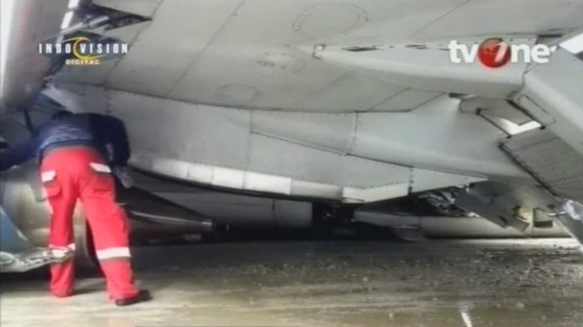WATCH: Indonesian airliner skids down runway after landing gear ripped ...
