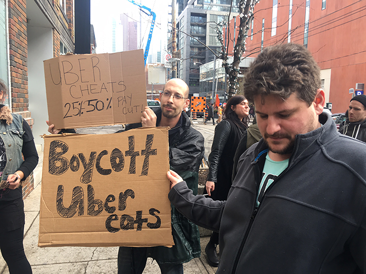 Toronto UberEATS delivery drivers protest new rate cut, call for ...
