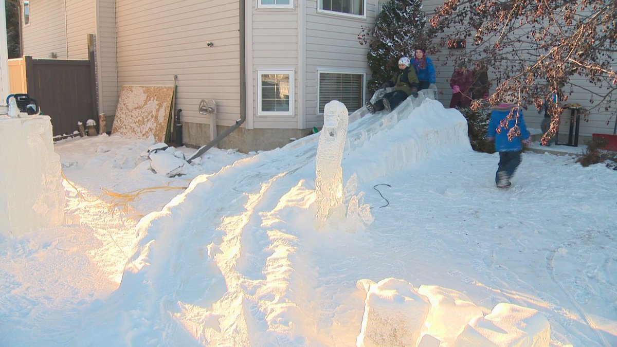 Ice carver uses leftovers to build massive slide in front yard ...