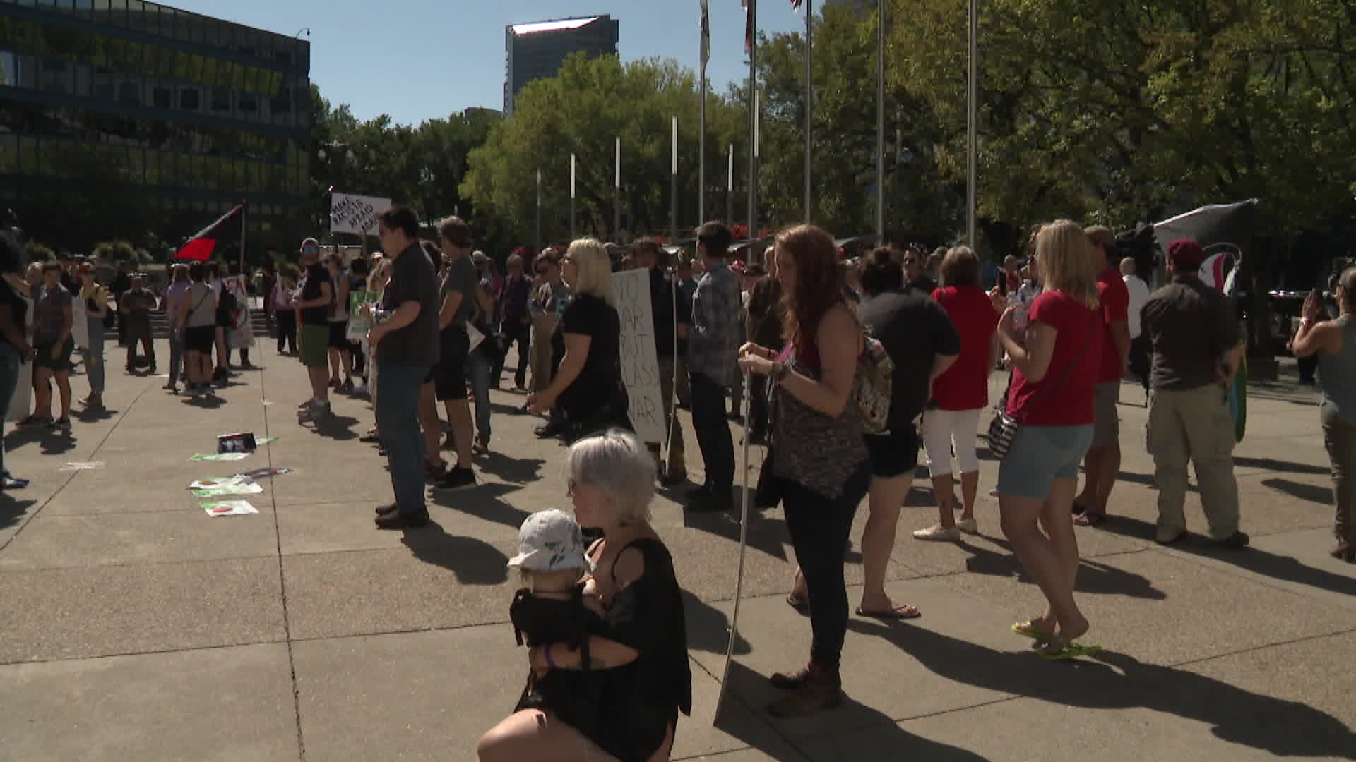 Protesters from opposing groups face off at Calgary City Hall ...