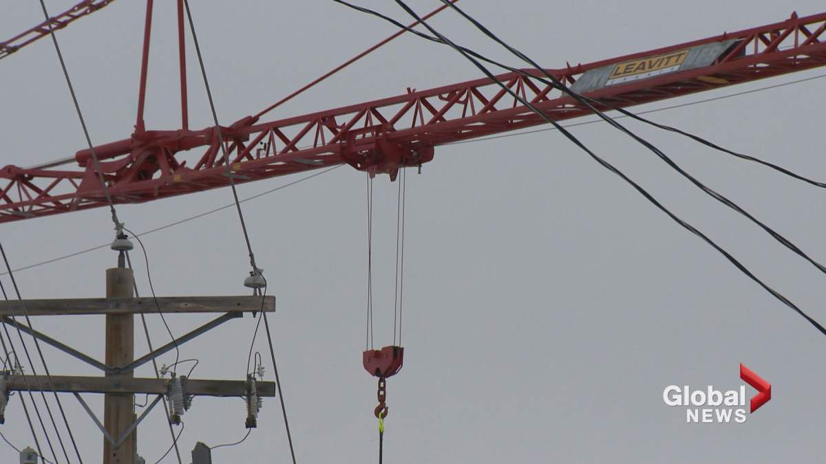 Crane strikes power lines causing outages, traffic snarls in northwest ...