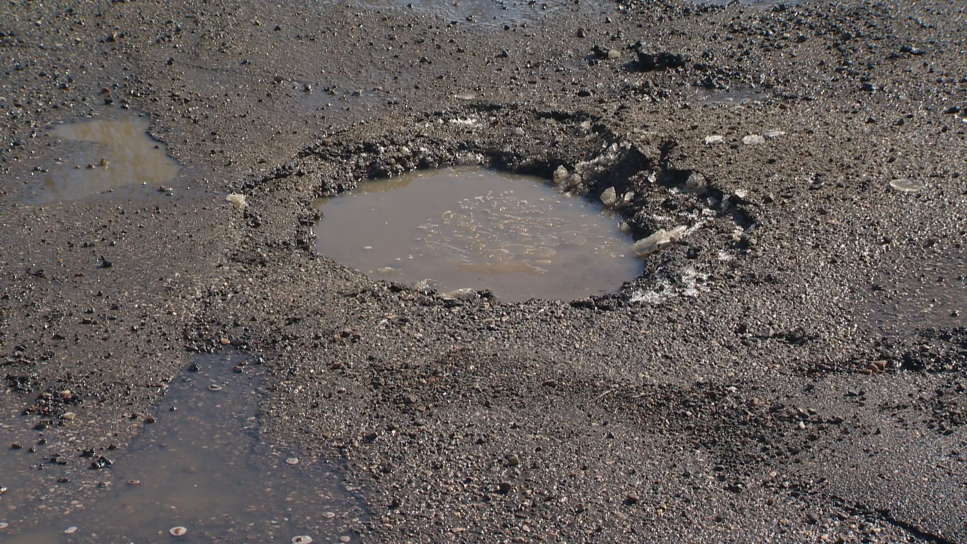 Potholes spring eternal amid warm weather in Regina - Regina ...