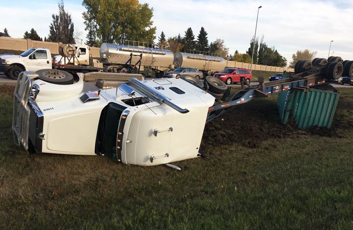 Semi carrying bagged seed rolls onto side in Saskatoon - Saskatoon ...