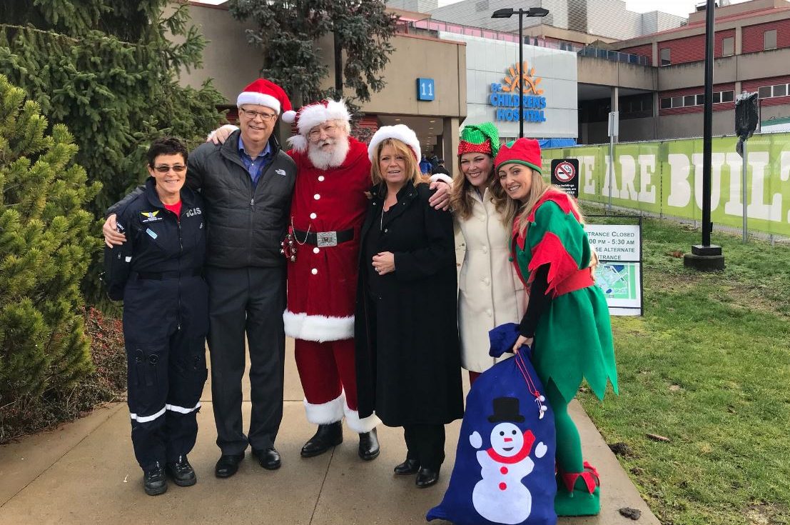 ‘Tis the season: Santa Claus takes to the skies to visit children in B ...