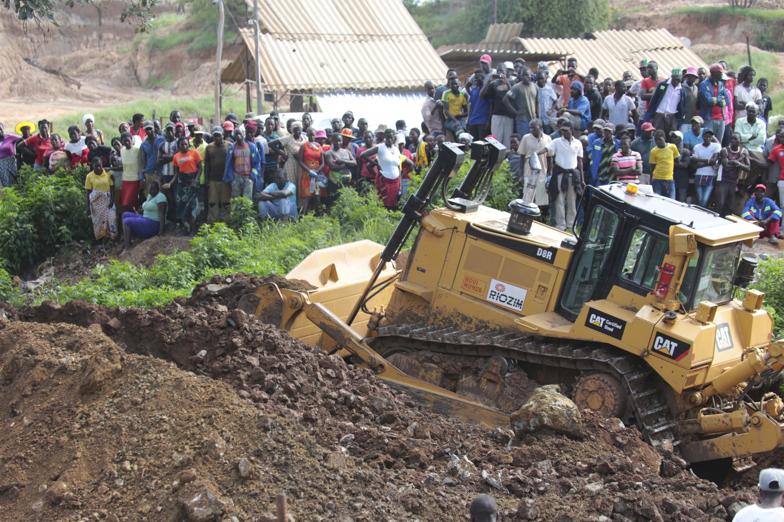 8 rescued, dozens more feared dead after Zimbabwe mine floods ...