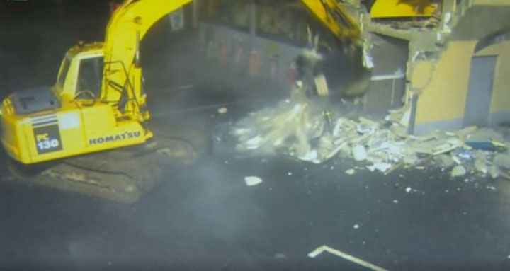Thieves withdraw bank machine from store wall using stolen excavator ...