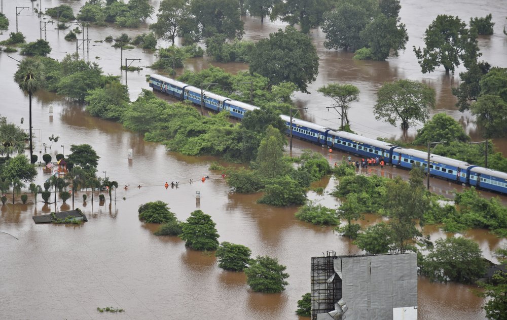 Hundreds rescued from train stuck in monsoon floodwaters in India ...