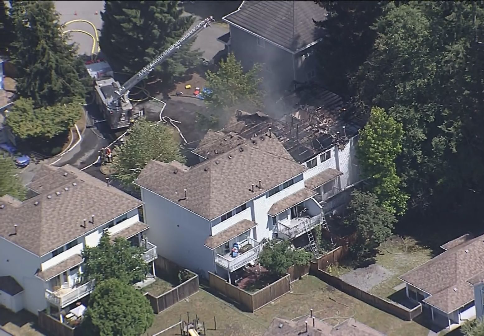 Road closed as crews battle intense fire at Surrey housing complex - BC ...