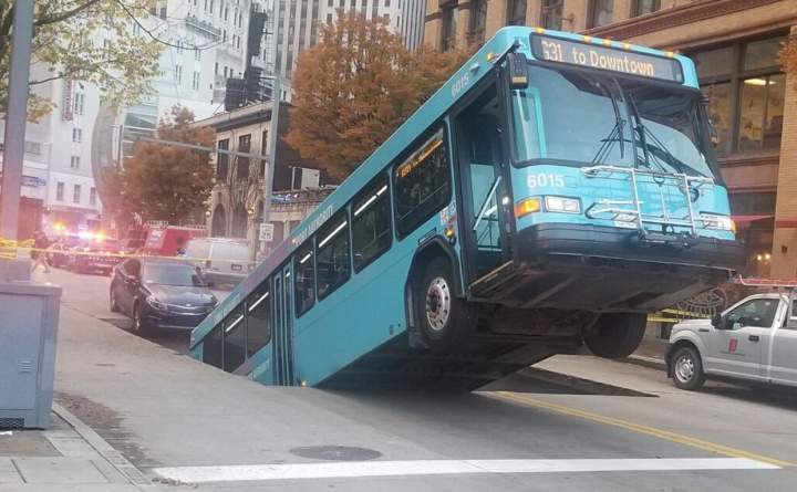 Sinkhole swallows half of Pittsburgh city bus during rush hour ...