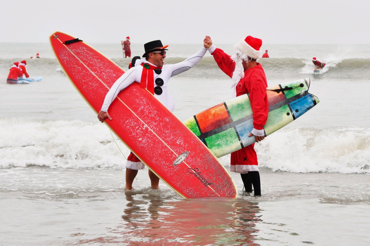 600 surfing Santas ride waves along Florida’s Space Coast - National ...
