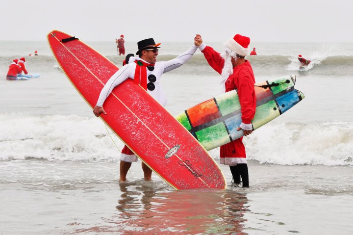 600 surfing Santas ride waves along Florida’s Space Coast - National ...