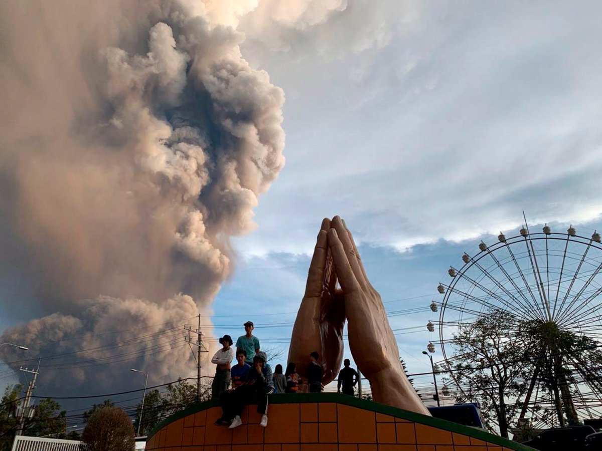 Tens of thousands flee as red-hot lava gushes from volcano near Manila ...