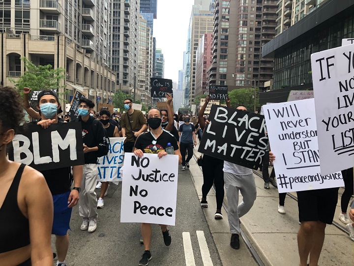 Anti-racism protesters march in Toronto to honour Black lives lost at ...