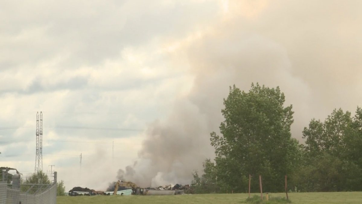 Air quality being monitored as crews battle fire at recycling facility ...