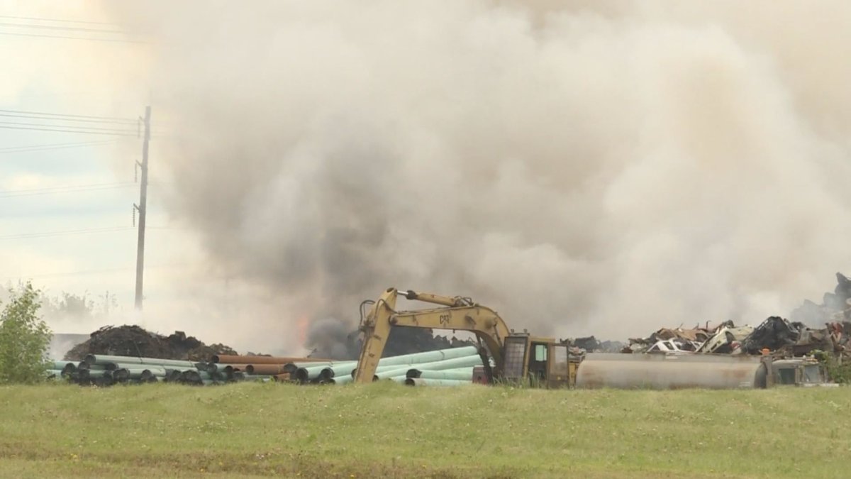 Air quality being monitored as crews battle fire at recycling facility ...