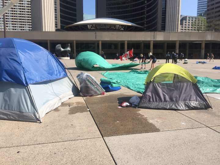 Demonstrators remove tents outside of Toronto City Hall after 3-week ...
