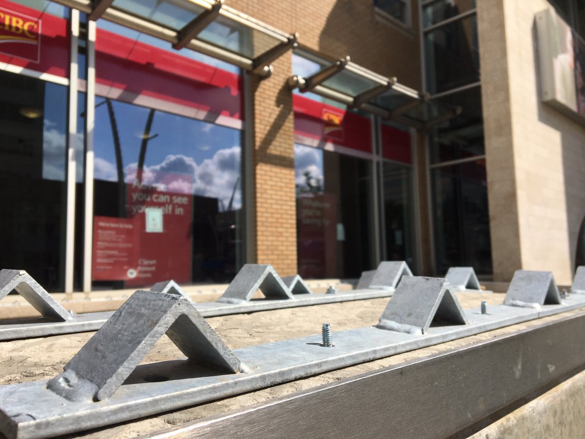 Edmonton bank blocks sitting space with metal triangle barriers ...