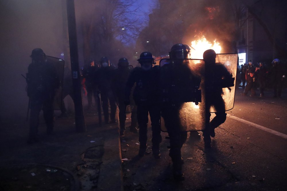 Paris protest descends into chaos as intruders set fire to cars ...