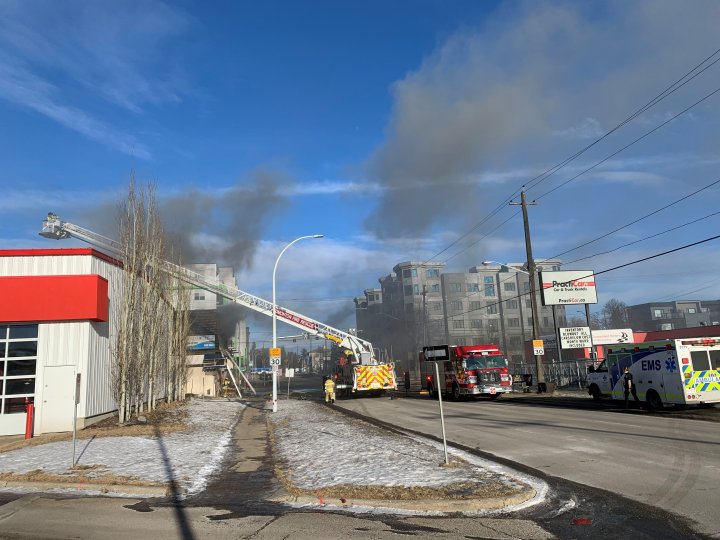 Strong winds make fire at Edmonton commercial building a challenge to ...