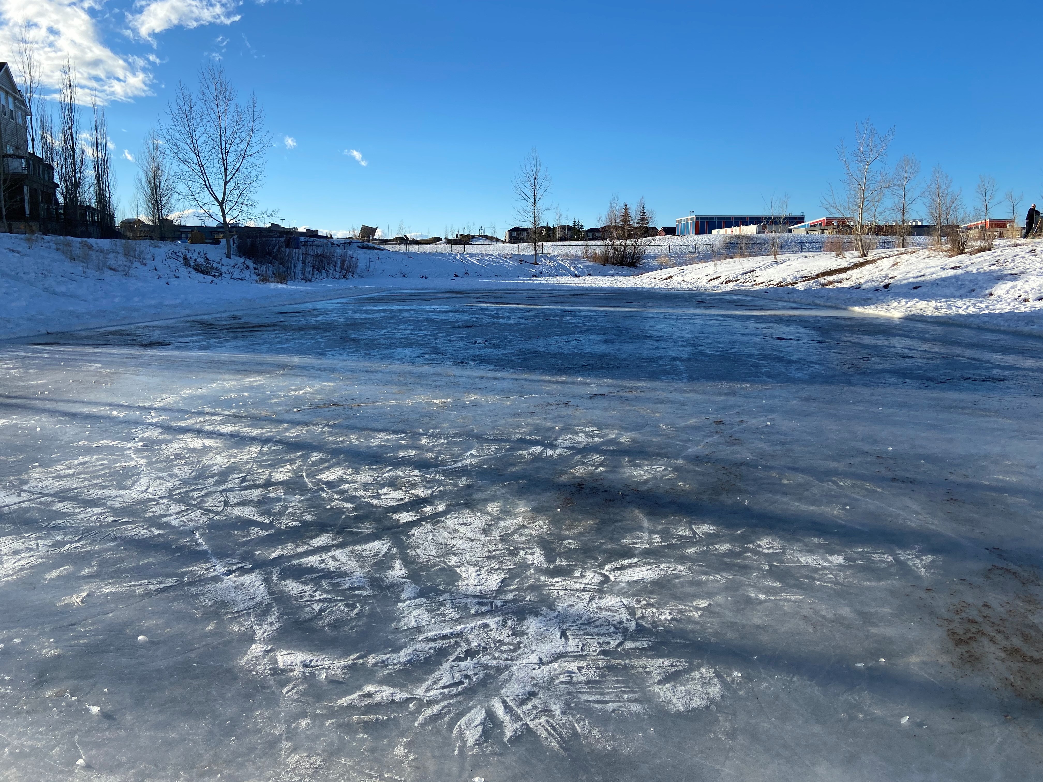 Storm pond rinks in Chestermere covered with sand by city officials ...